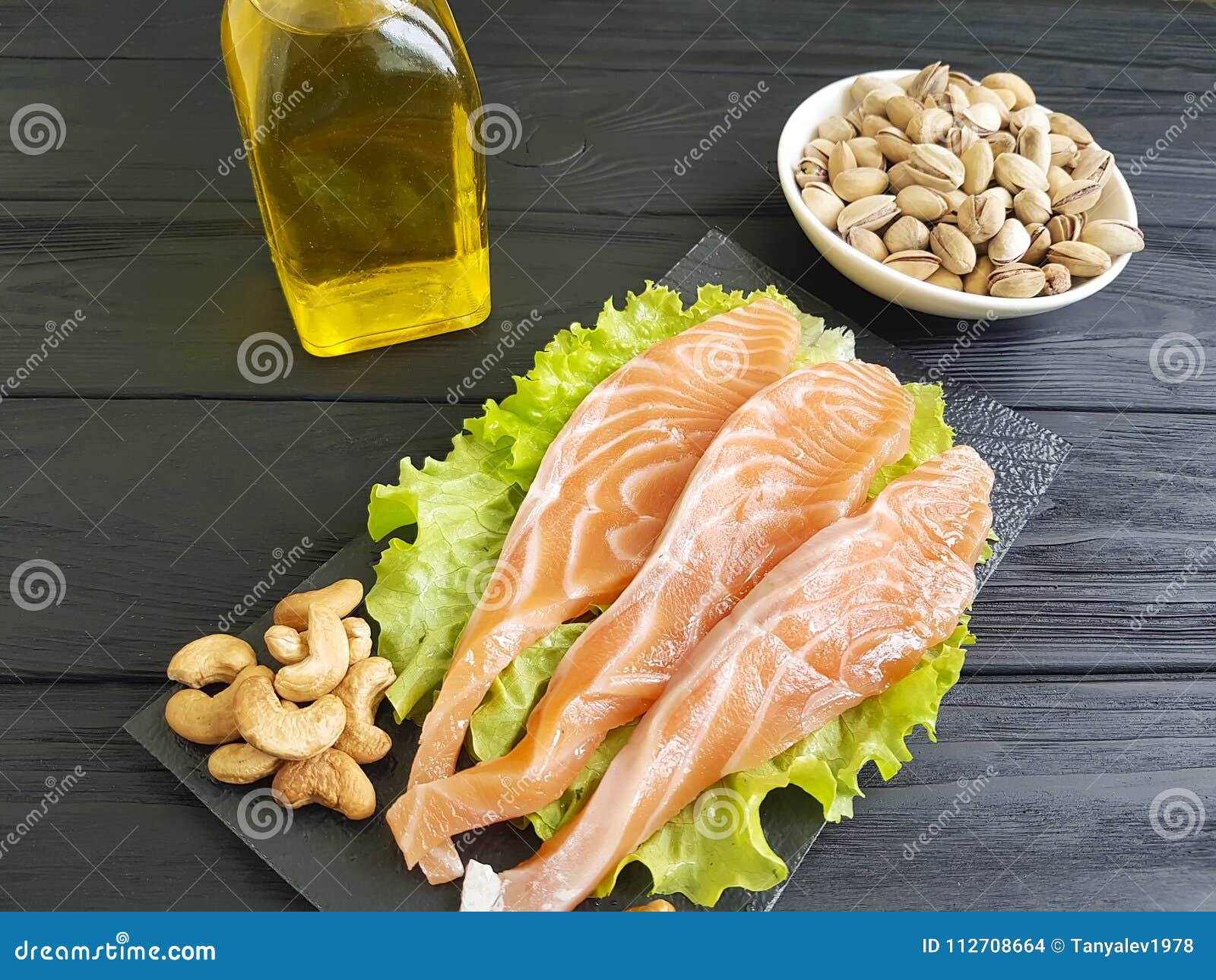 Red Fish, Oil Nuts on the Wooden Stock Photo - Image of food, cutting ...