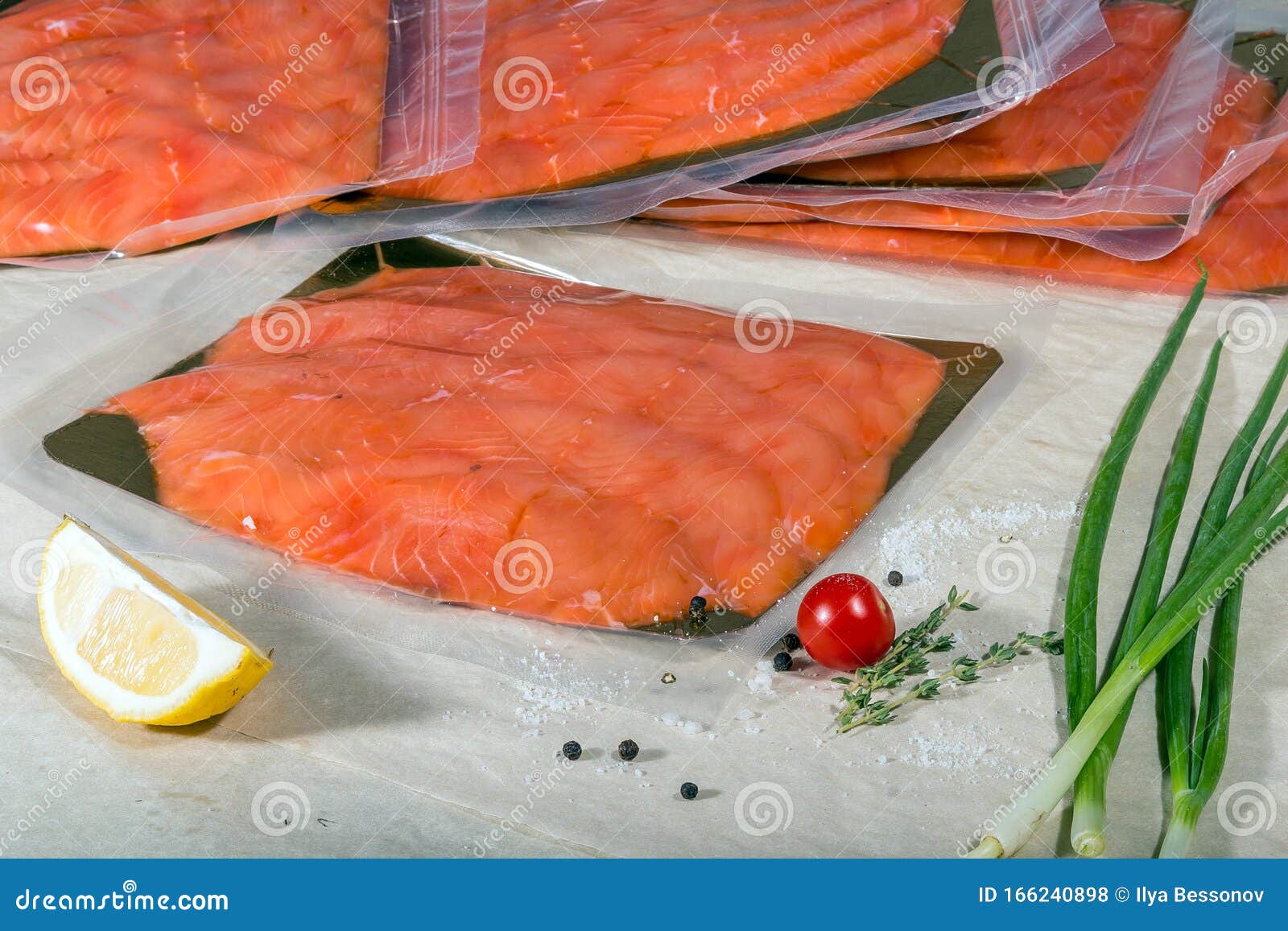 Red Fish in a Sealed Vacuum Plastic Bag on the Background of a Stack of ...