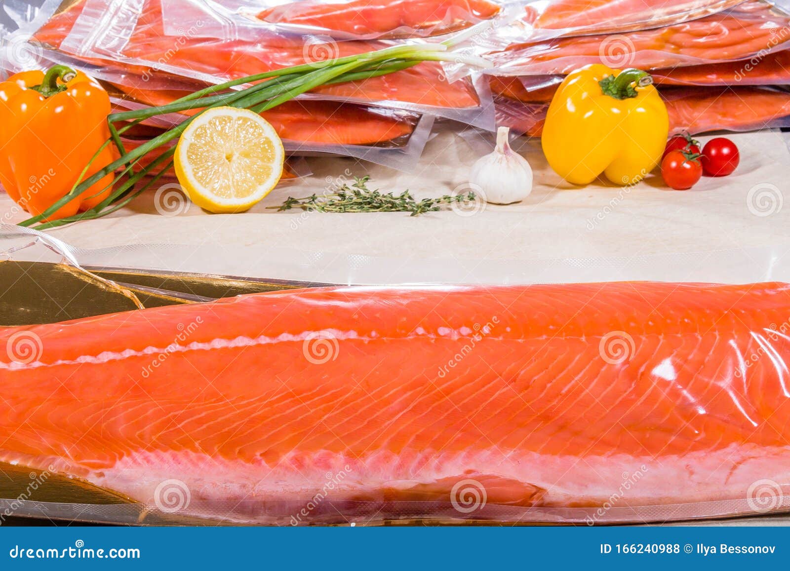 Red Fish in a Sealed Vacuum Plastic Bag on the Background of a Stack of ...