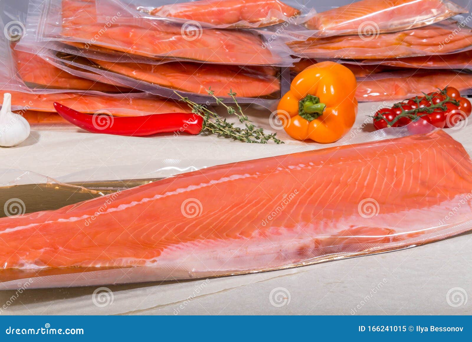 Red Fish in a Sealed Vacuum Plastic Bag on the Background of a Stack of ...