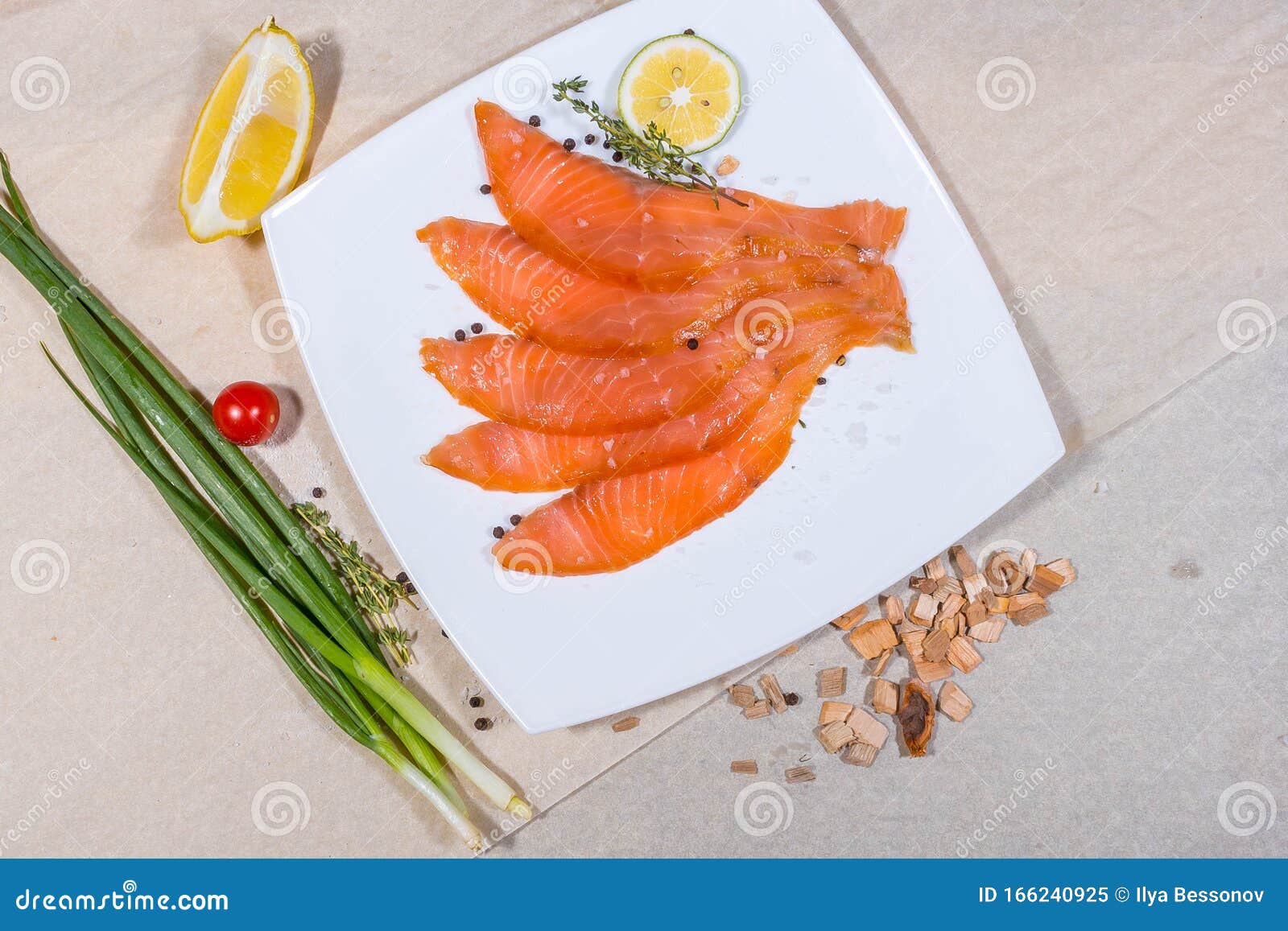 Red Fish Sliced in Slices Lies on a White Plate. Around Vegetables and ...