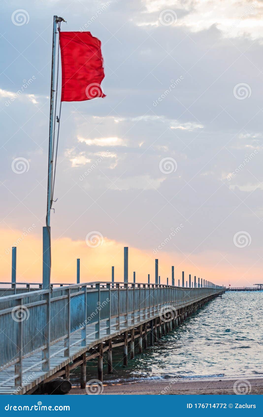 Red Flag Flying on Pontoon Bridge Stock Photo - Image of flag, reef ...