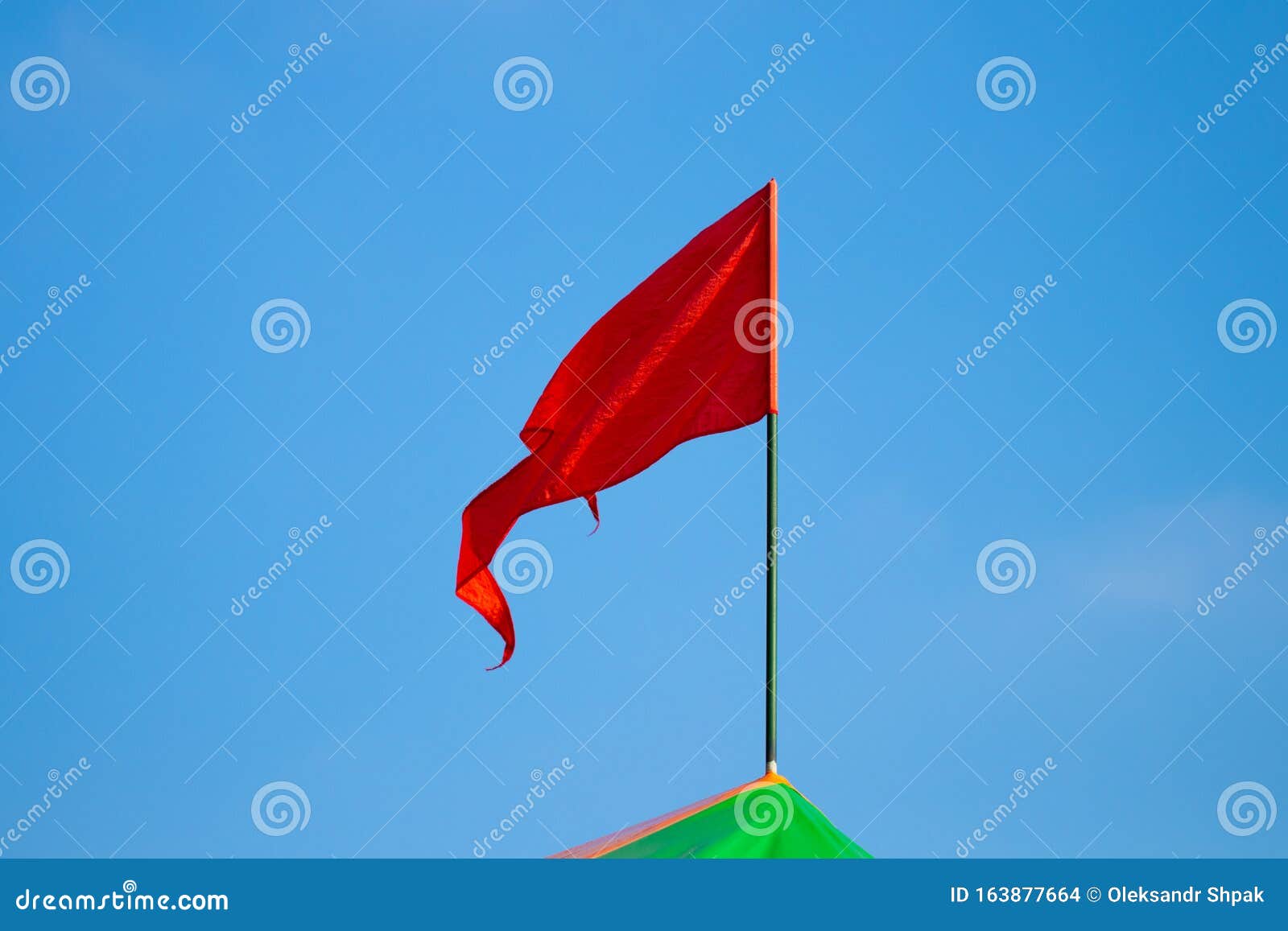 Red Flag Waving on Blue Sky Background Stock Photo - Image of ...