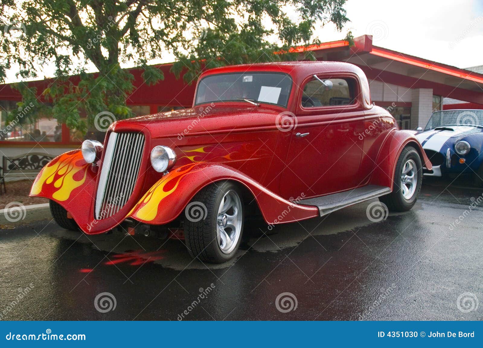 Red Flamed Hotrod in rain stock photo. Image of yellow - 4351030
