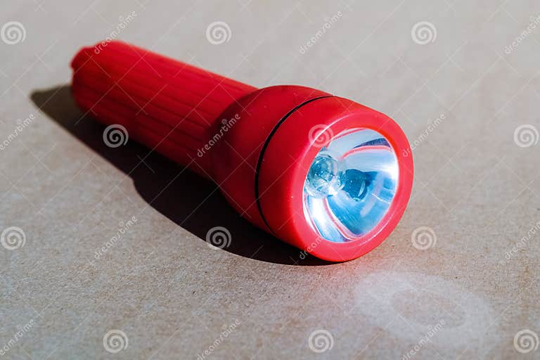 Red Flashlight on a Cardboard Background Stock Image - Image of white ...
