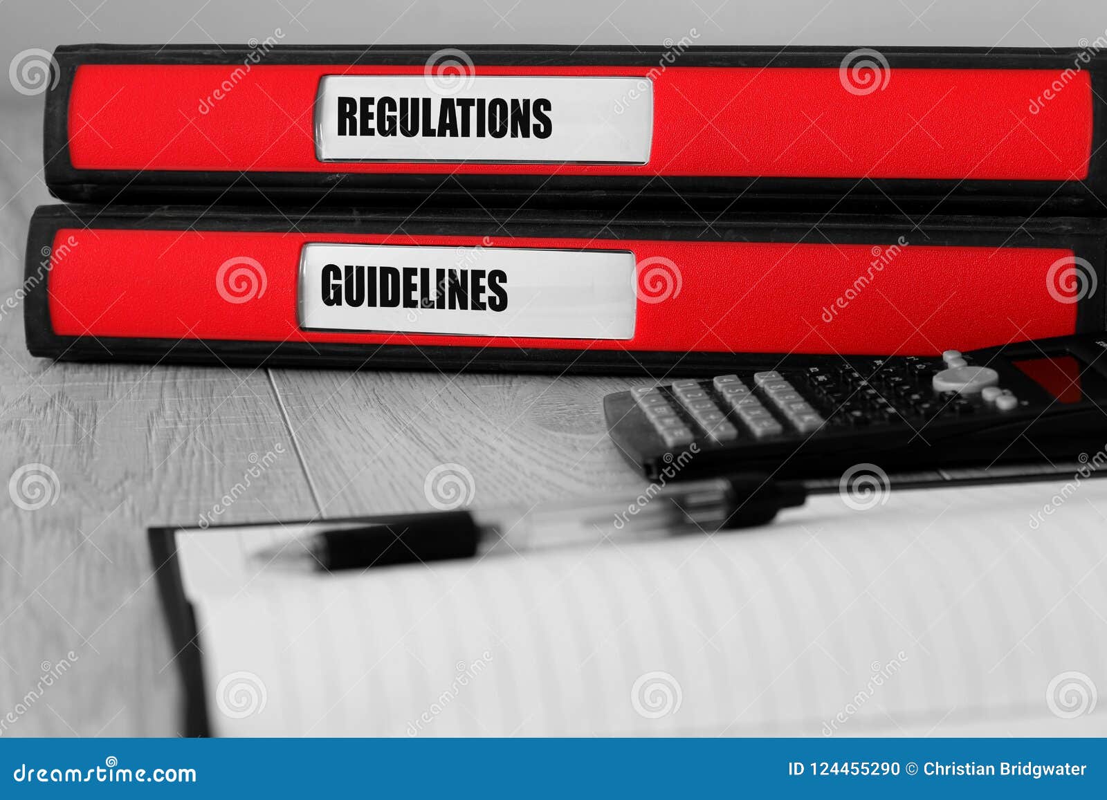 Red Folders with Regulations and Guidelines Written on the Label on a ...