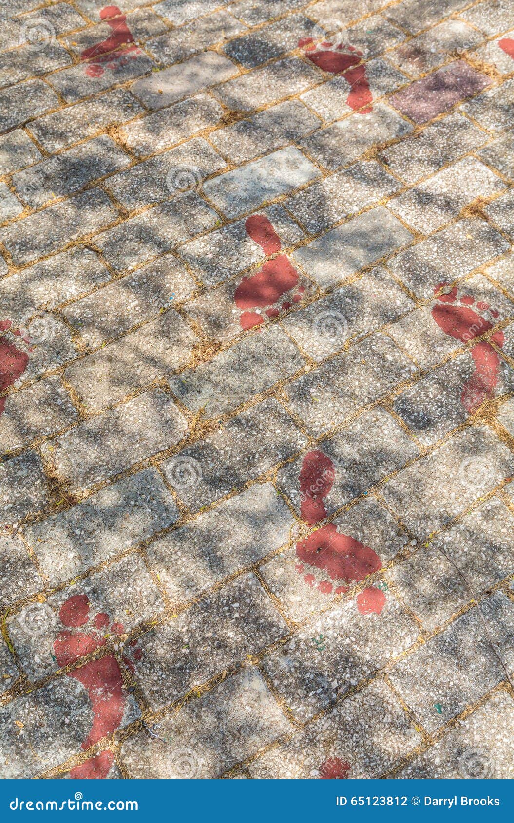 Red Footprints on Sidewalk stock photo. Image of brick - 65123812