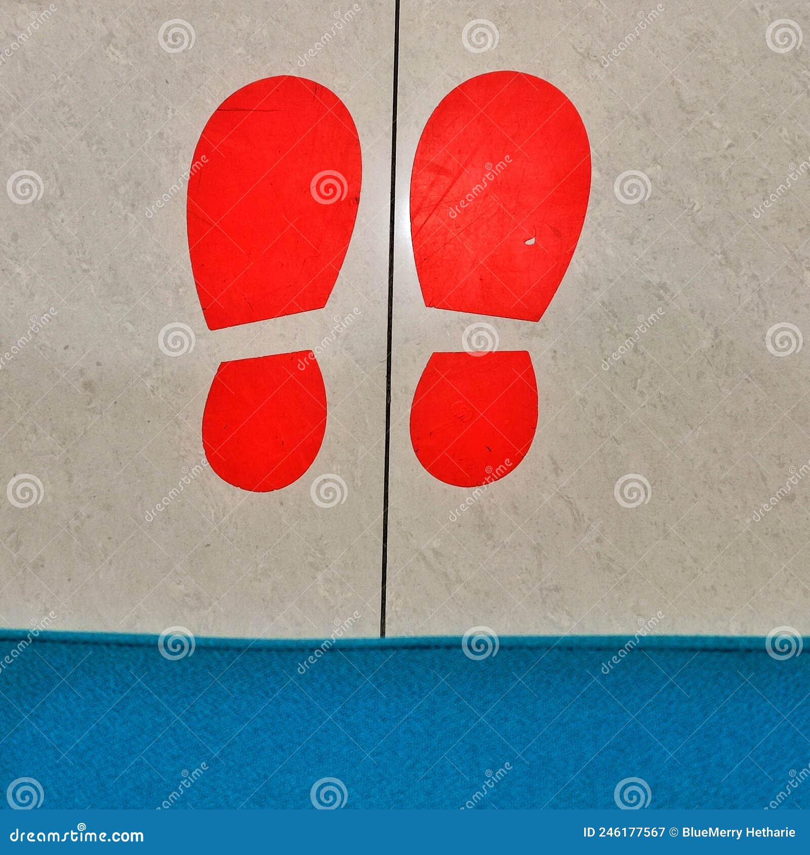 Red Footsteps Marks on Tiles Under Blue Couch Stock Image - Image of ...