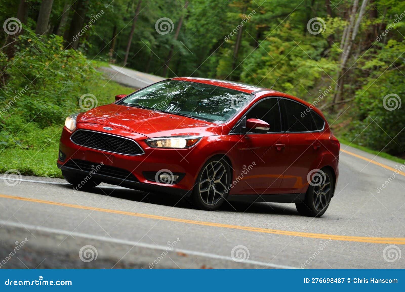 Ford Focus Second Generation C307 In Motion On The Street. White Car ...