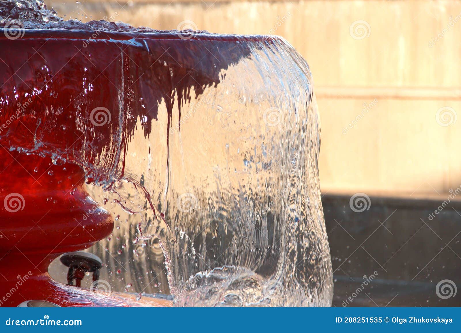 Red Fountain on a Light Background. Water Stock Image - Image of ...
