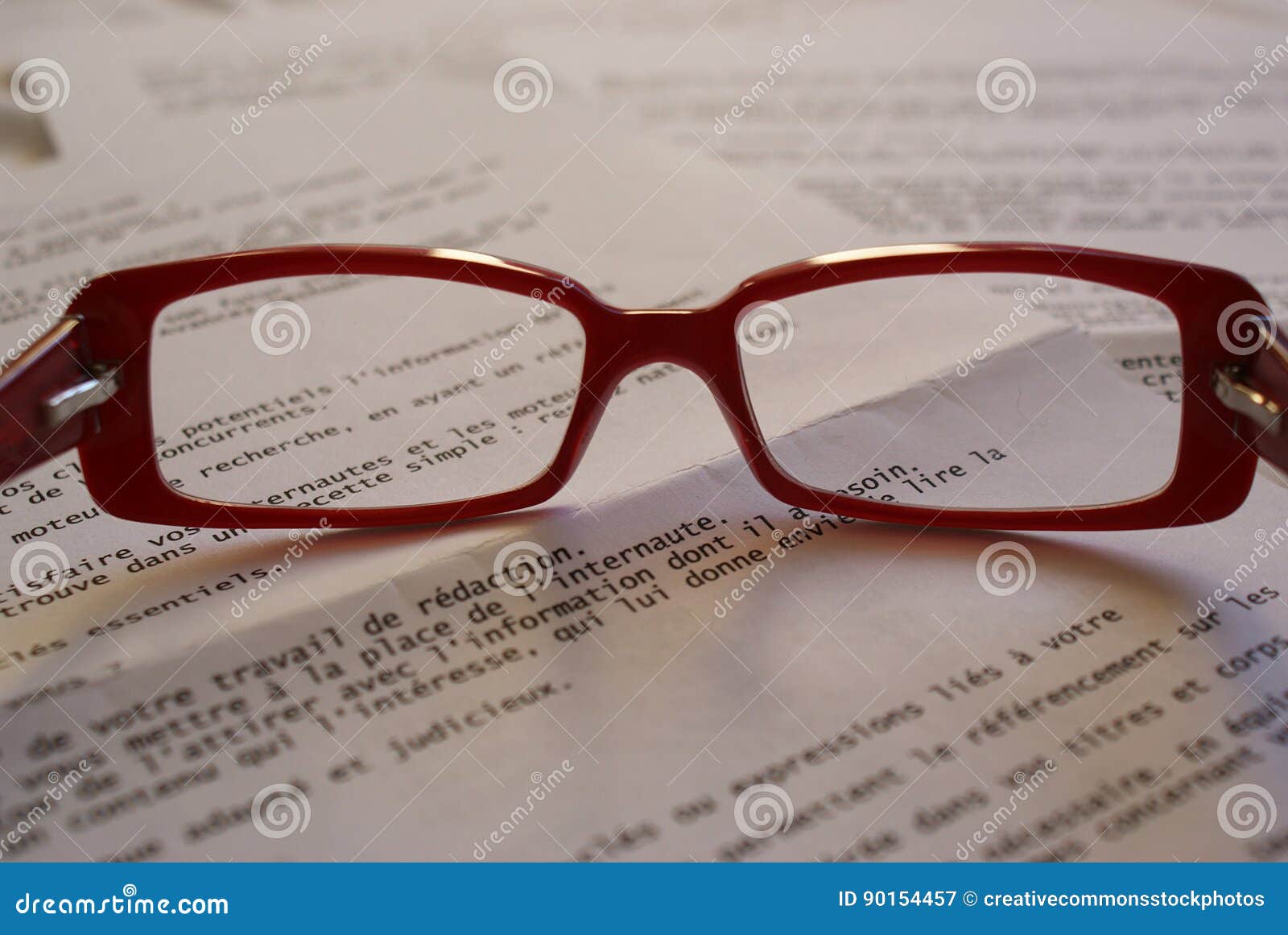 Red Framed Eyeglass On Top Of Paper Picture. Image: 90154457