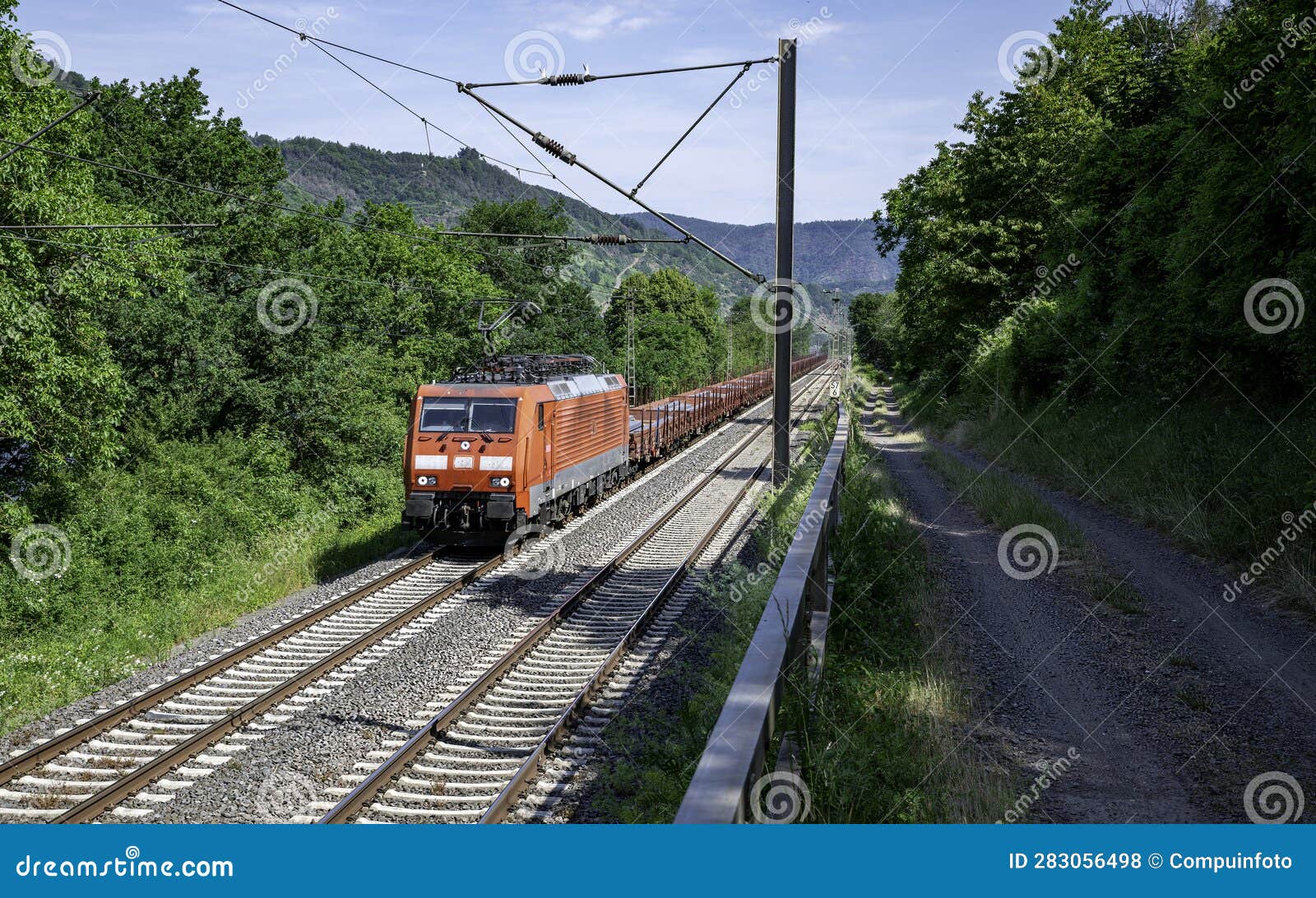 A Train of the Deutsche Bundesbahn Drives through the German Green ...