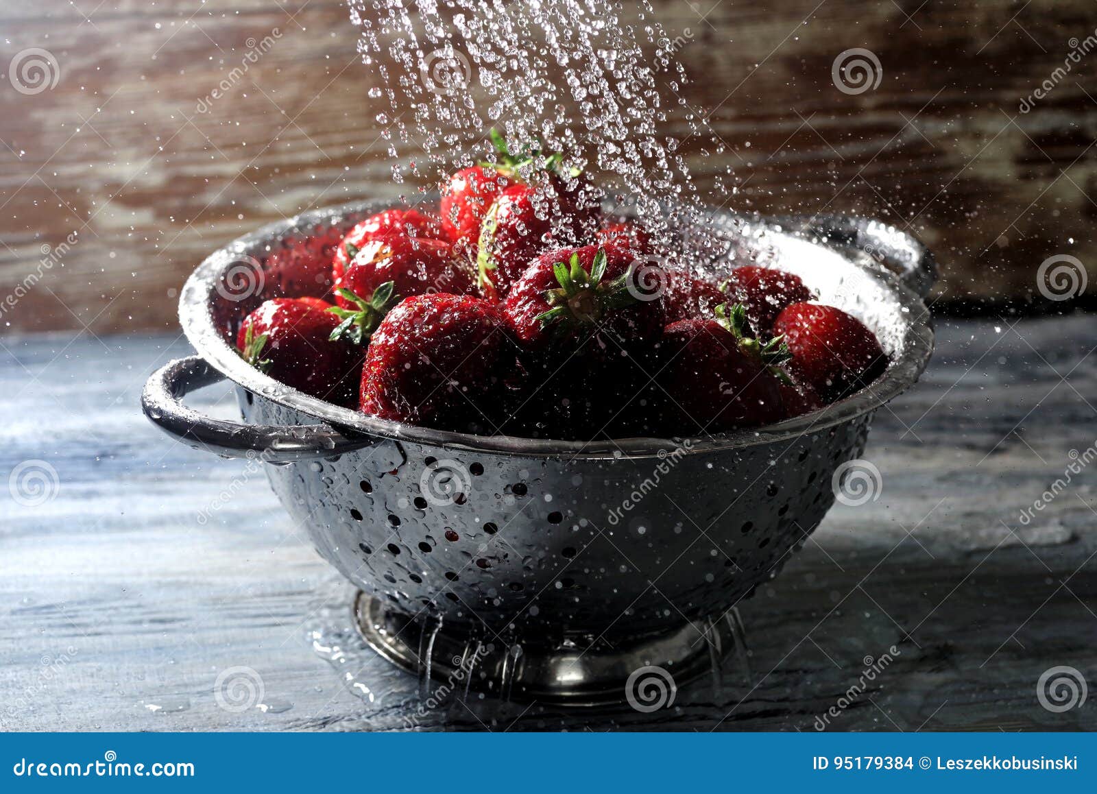 Red Freshly Picked Strawberries are Washed Under Running Water. Stock ...