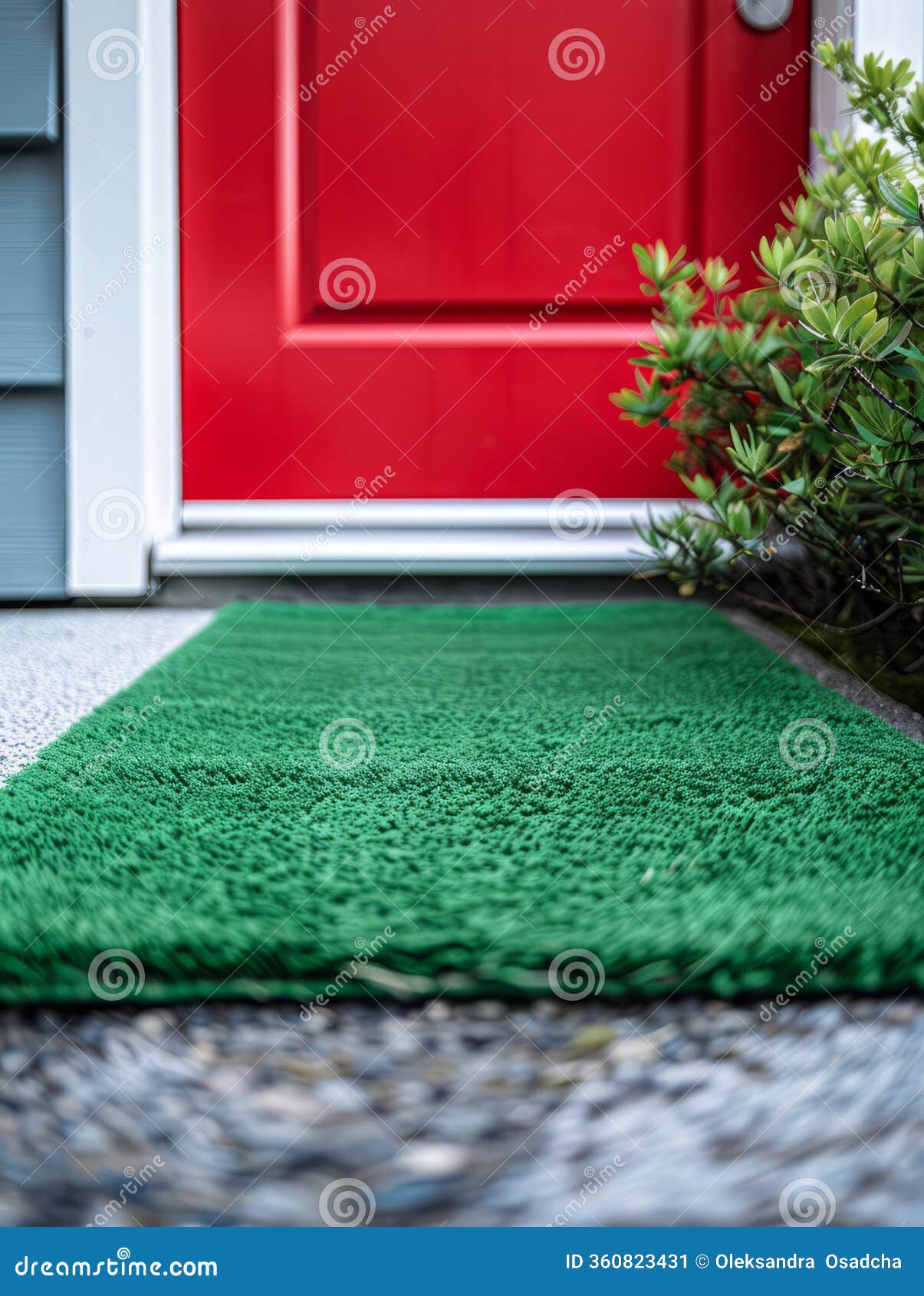 A Red Front Door with a Green Welcome Mat and Shrub on the Side. Stock ...