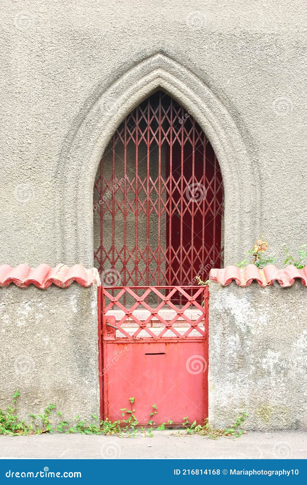 Red Front Metal Gate and the Arch of an Old Building Stock Photo ...