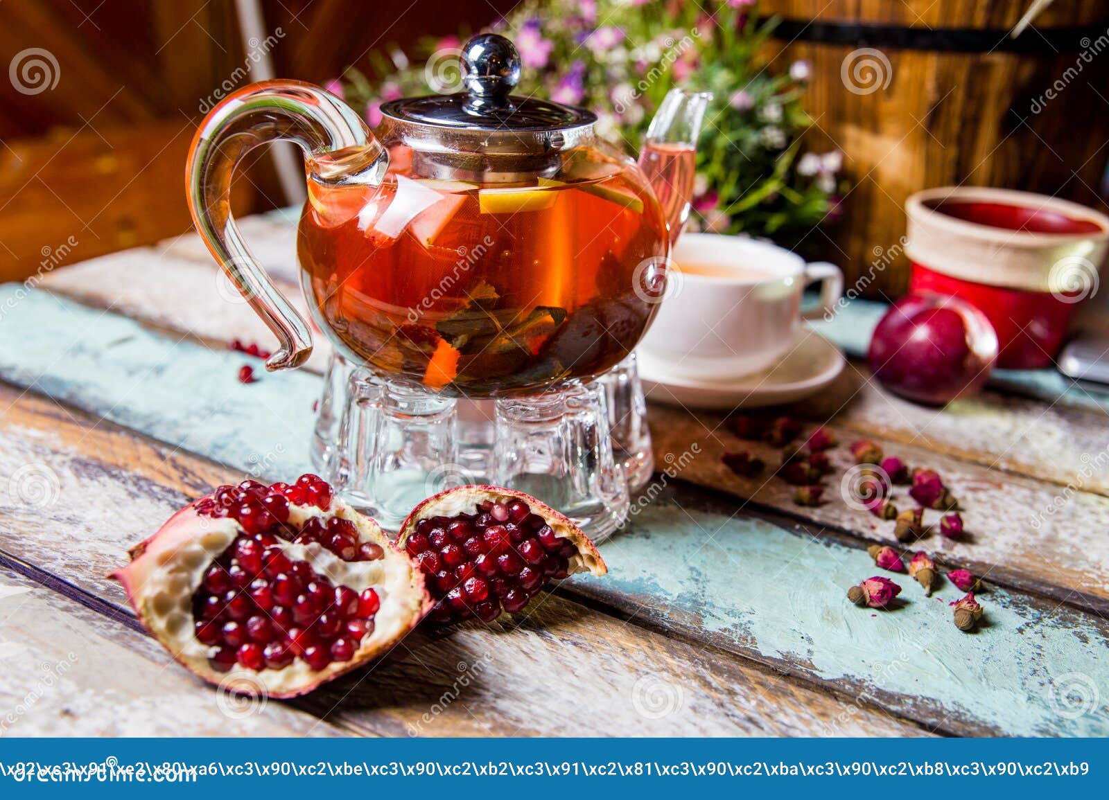 Red Fruit Tea in a Teapot with Pomegranate on the Table Stock Photo ...