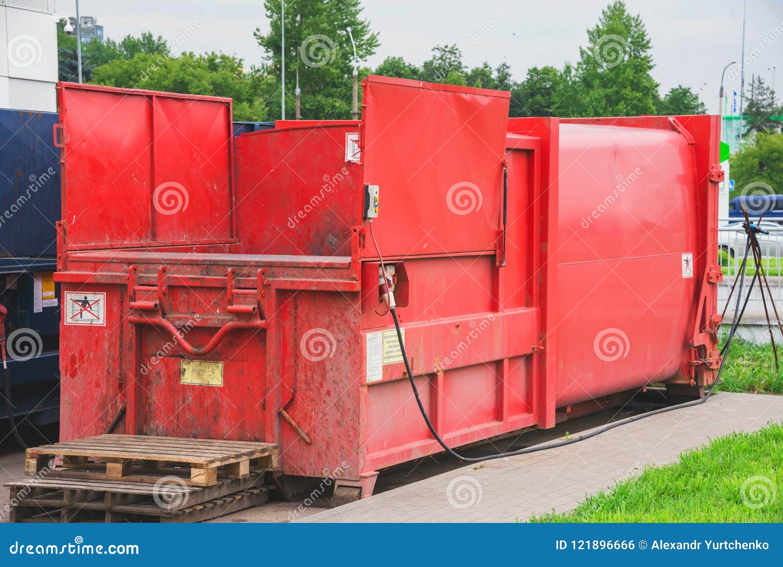 Red garbage press stock photo. Image of machine, recycling - 121896666