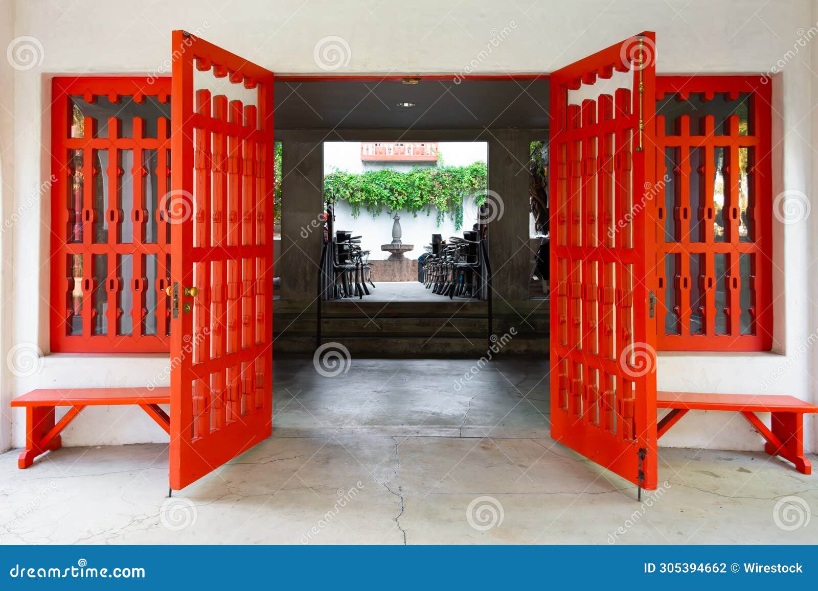 Red Gate Open To the Courtyard of a Wedding Reception Stock Photo ...