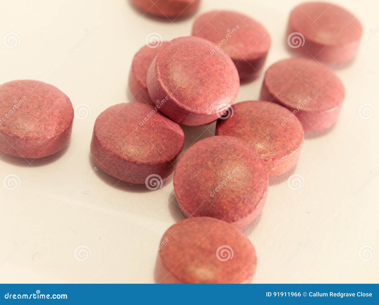 Red Generic Vitamin Pills and Tablets on a White Background Cure Stock ...