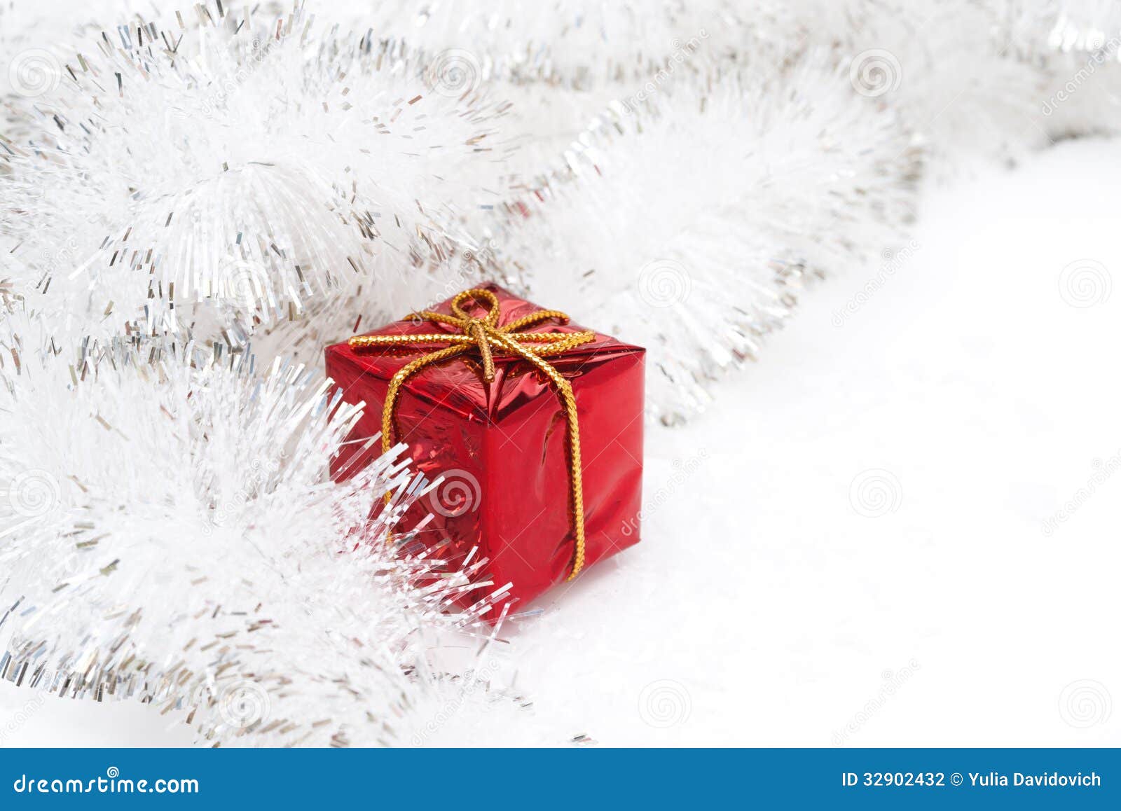 Red Gift Box and Christmas Tinsel on a White Background Stock Photo ...