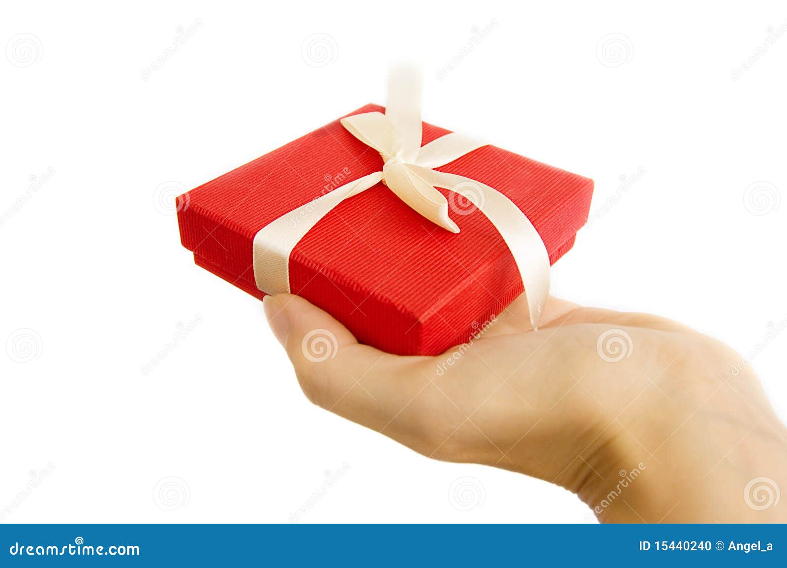 Red gift box in hand stock photo. Image of ribbon, present - 15440240