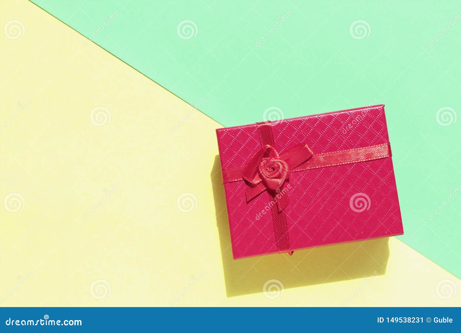 Red Gift Box on Two Color Yellow and Green Background Stock Image ...