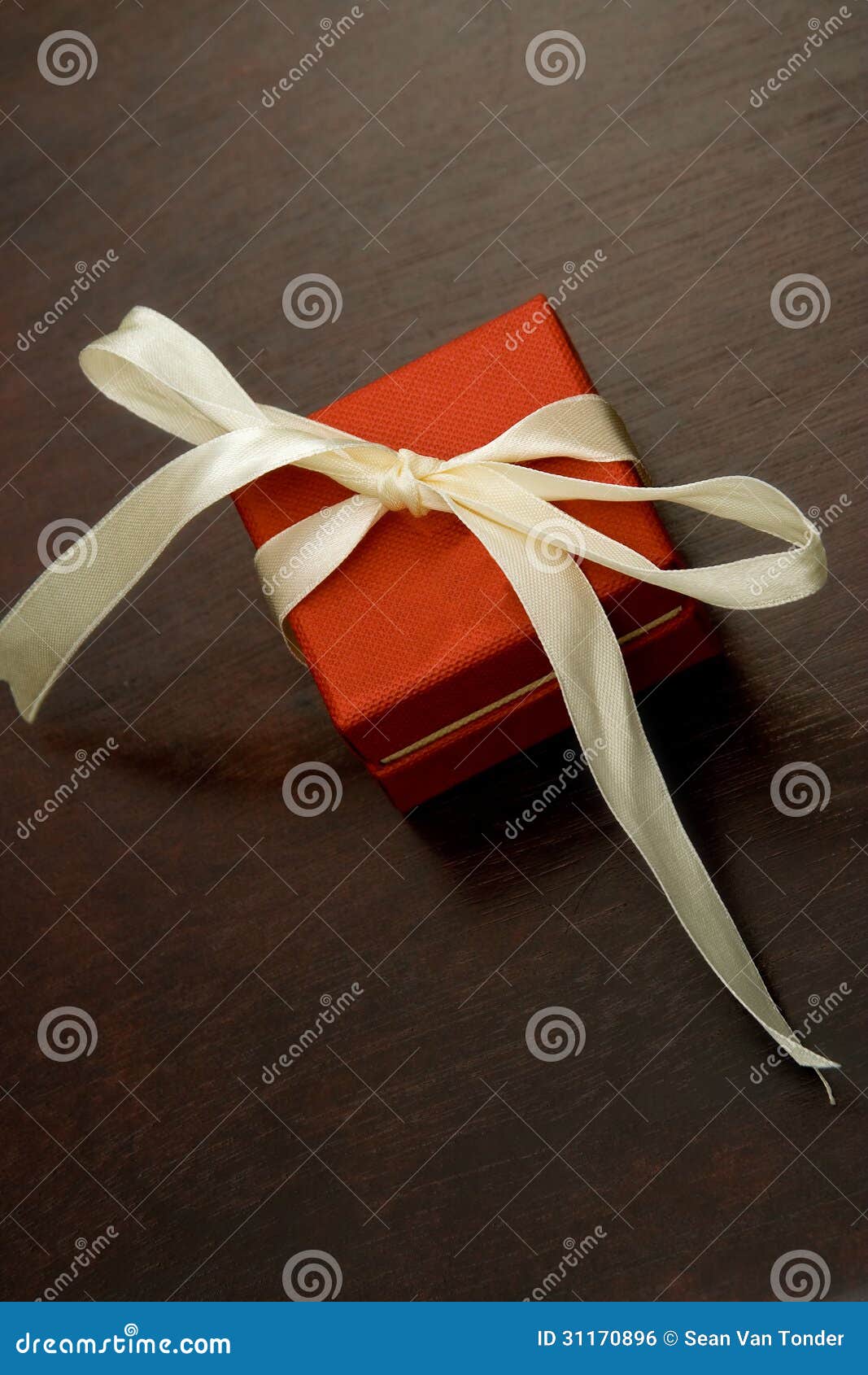 Red Gift with a Satin Ribbon Stock Photo - Image of traditional, cream ...