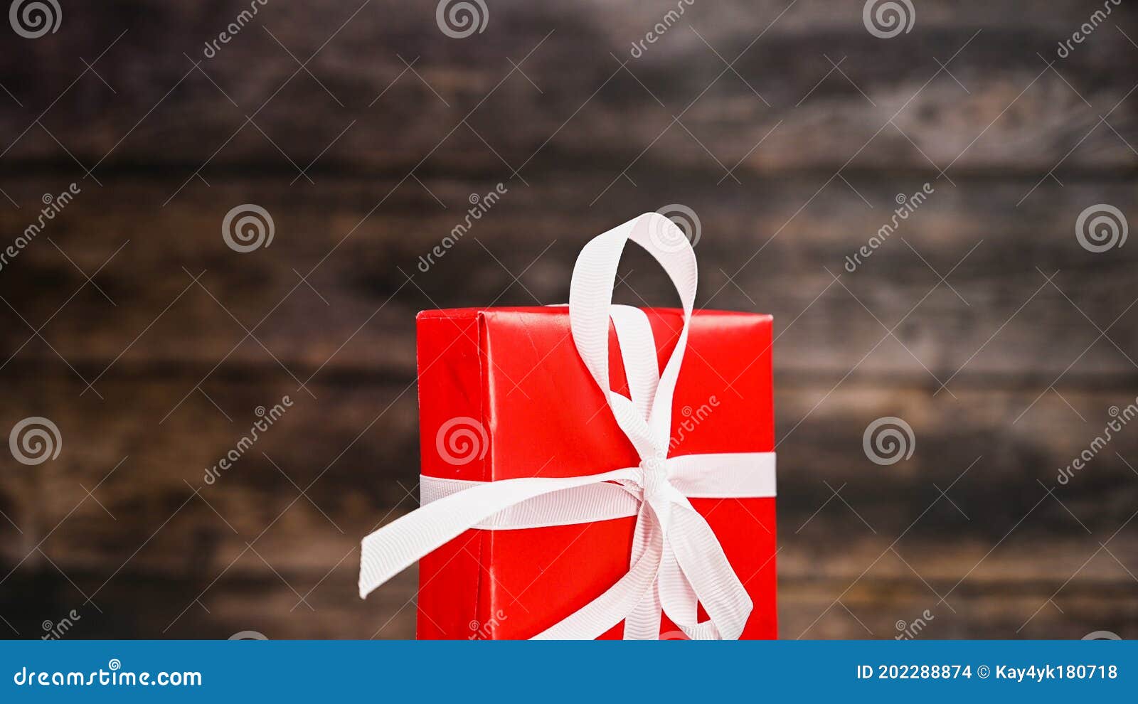 Red Gift Wrap on Black Background Stock Photo - Image of decoration ...