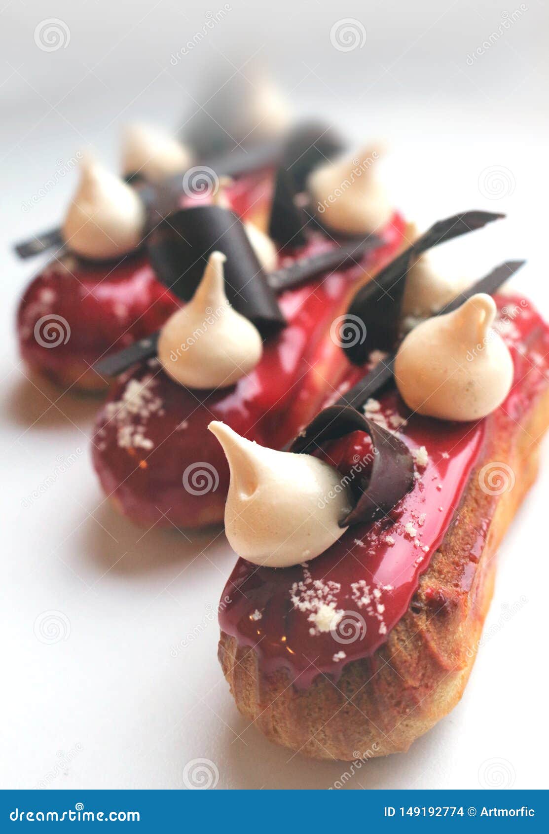 Red Glazed Raspberry Eclairs with Mirror Glaze, Meringues and Chocolate ...