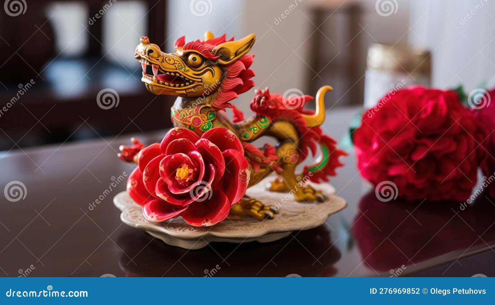 A Red and Gold Dragon Figurine Sitting on Top of a Table Stock ...