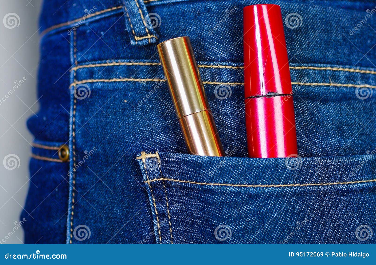 Red and Golden Lipsticks Inside of Jeans Back Pocket Stock Image ...