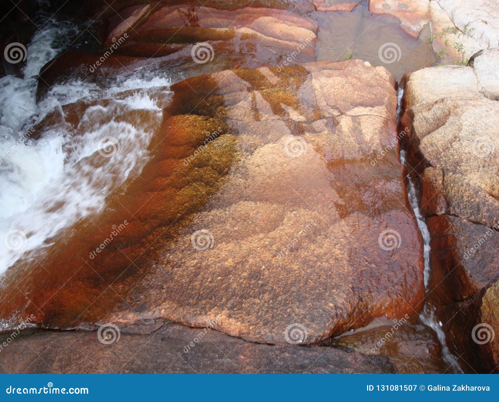 Red Granite Stones by Flowing Water of Waterfall Over it. Stock Image ...