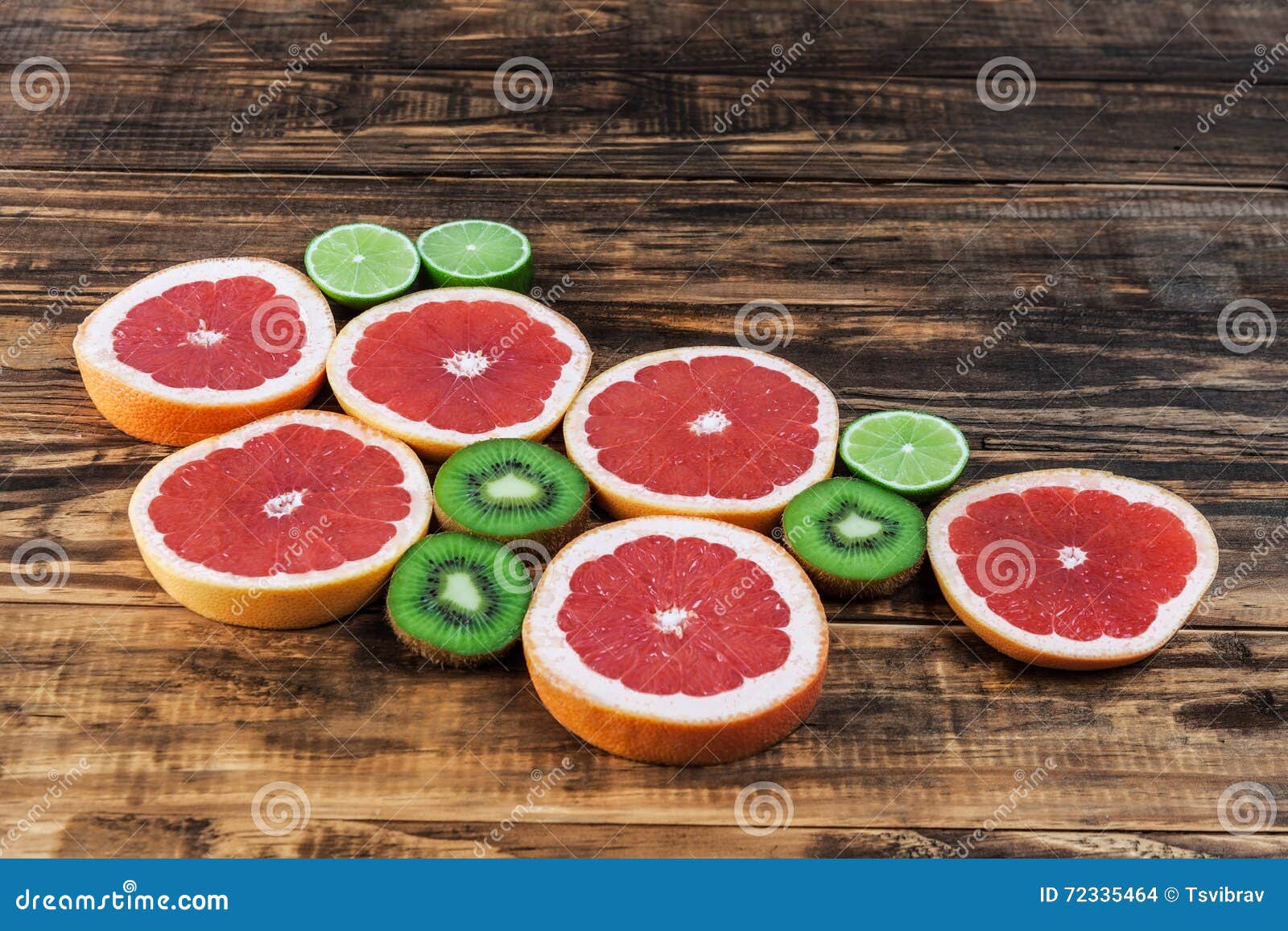 Red Grapefruit, Kiwi, and Lime on Wooden Table Stock Photo - Image of ...