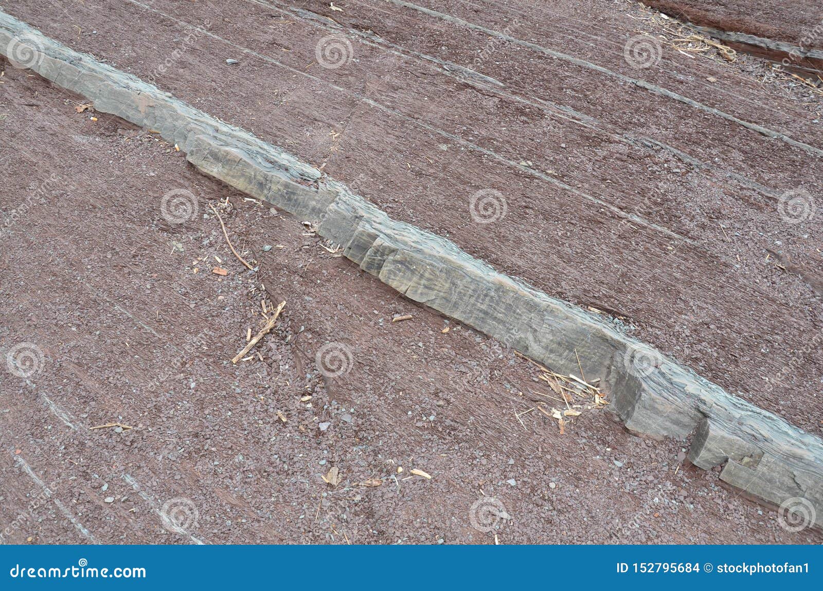 Red and Grey Rock Layers or Strata on the Ground Stock Photo - Image of ...