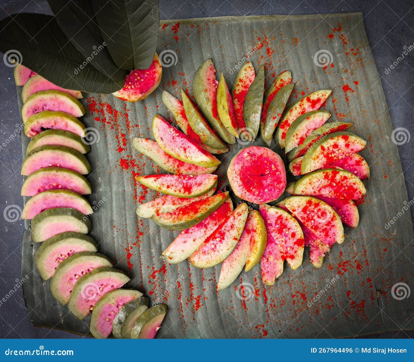 Red Guava Fruit with Banana& X27;s Green Leaf Stock Photo - Image of ...