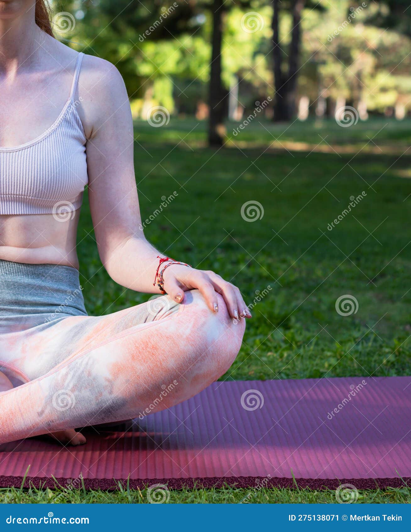 A Red Haired Fair Skinned Woman Practicing Yoga And Meditation In The