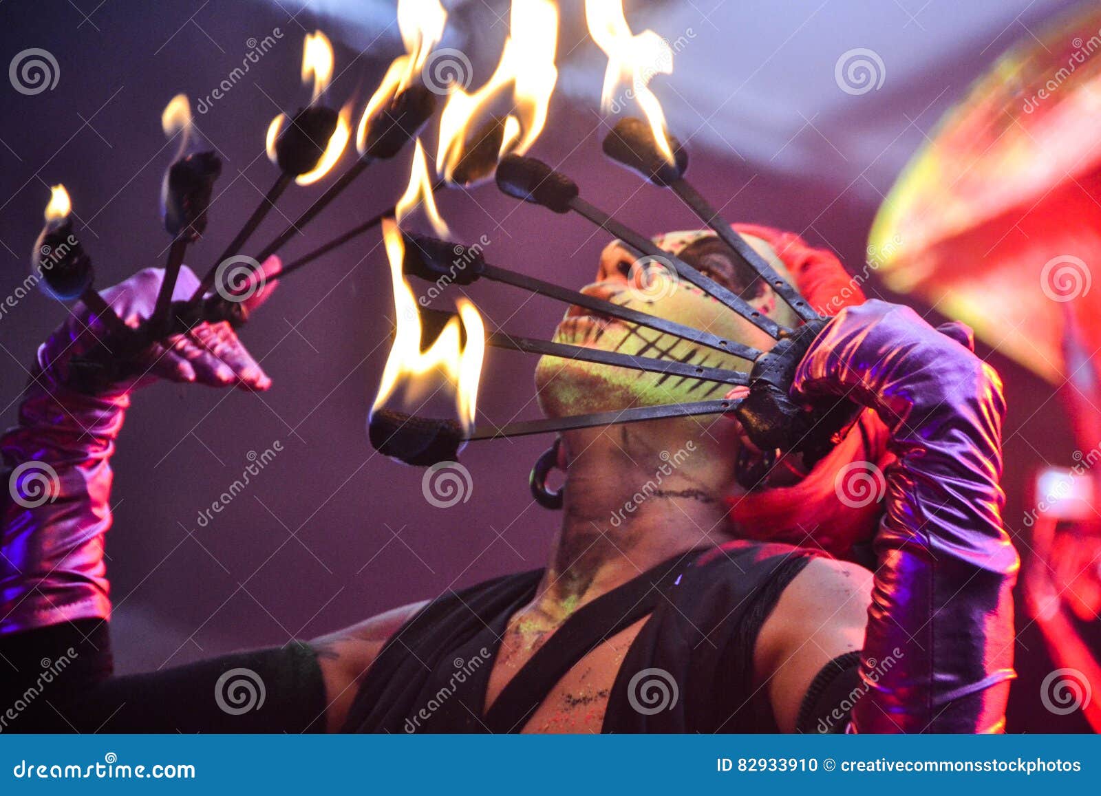 Red Haired Fire Dancer Blowing Rod With Flames Picture. Image: 82933910