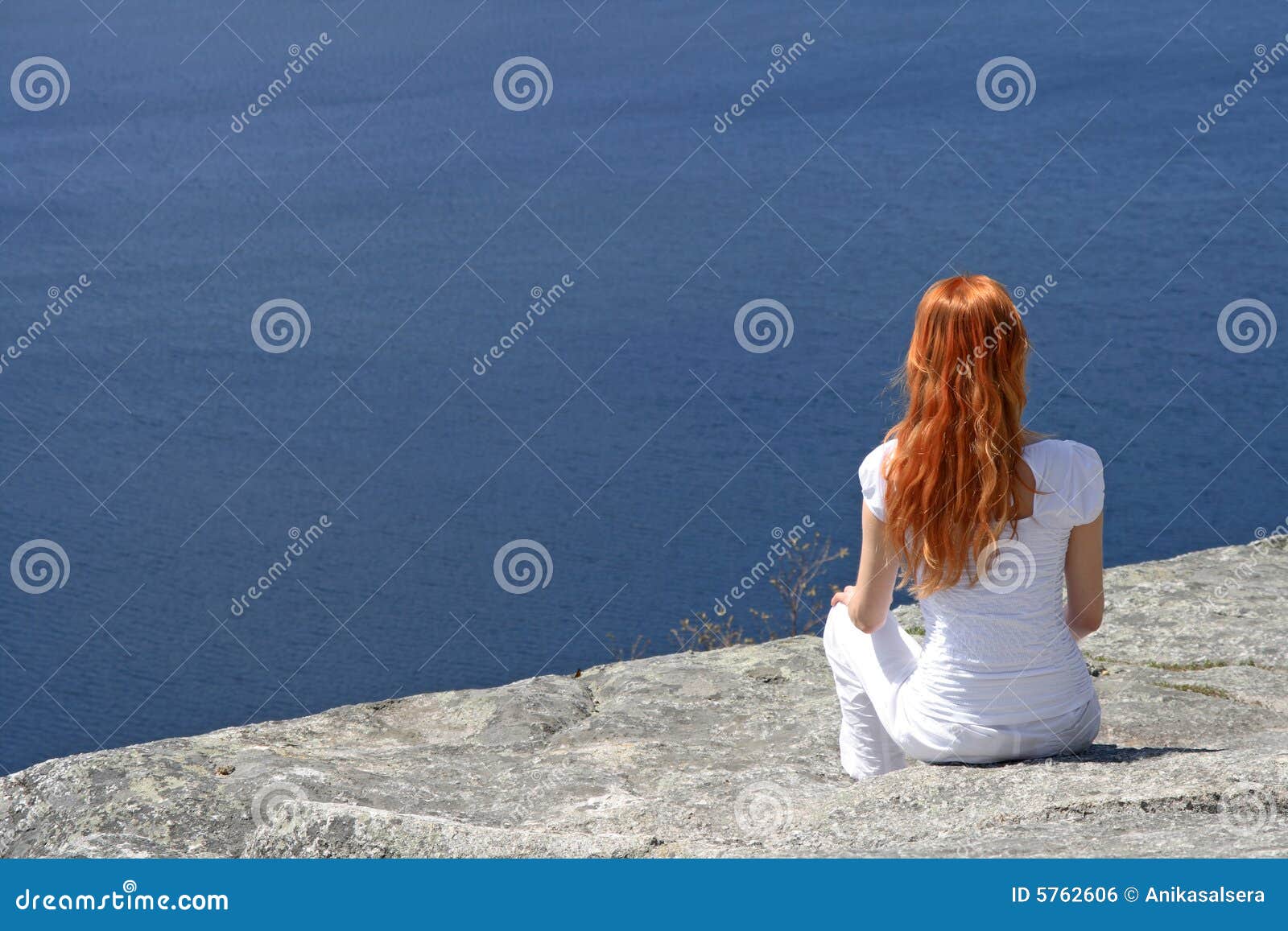 Red-haired Girl Looking Over Blue Water Stock Photo - Image of haired ...