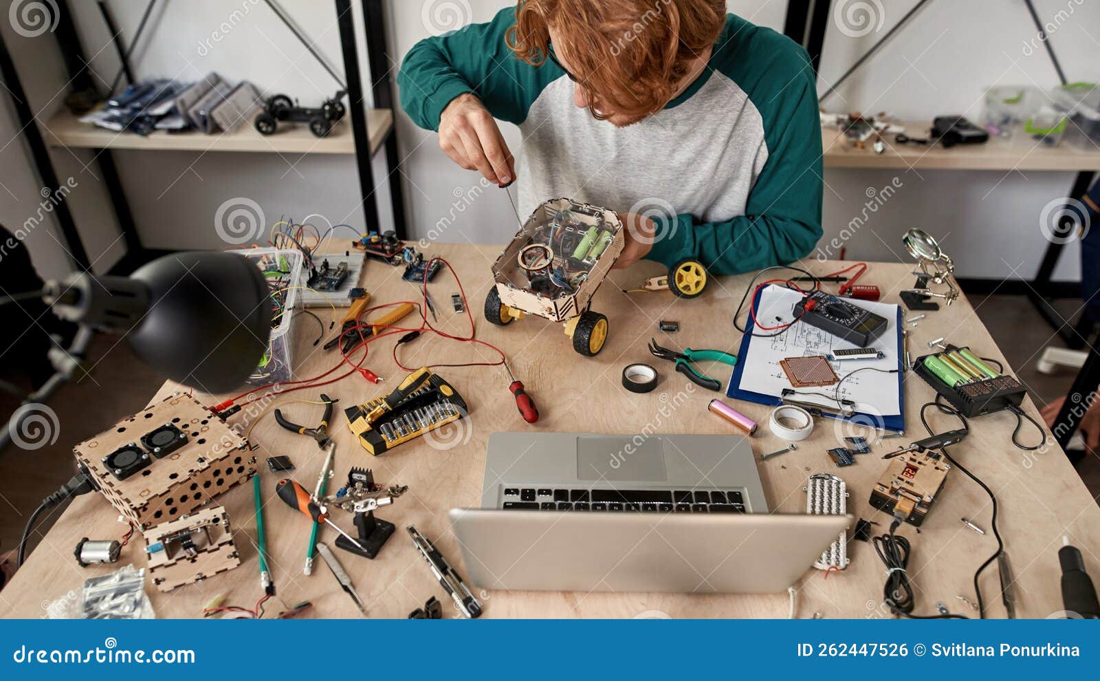 Red Haired Male it Engineer Fix Broken Wheel Robot Stock Photo - Image ...