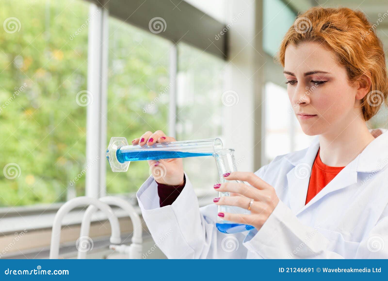 Red-haired Scientist Pouring Liquid Stock Image - Image of chemist ...
