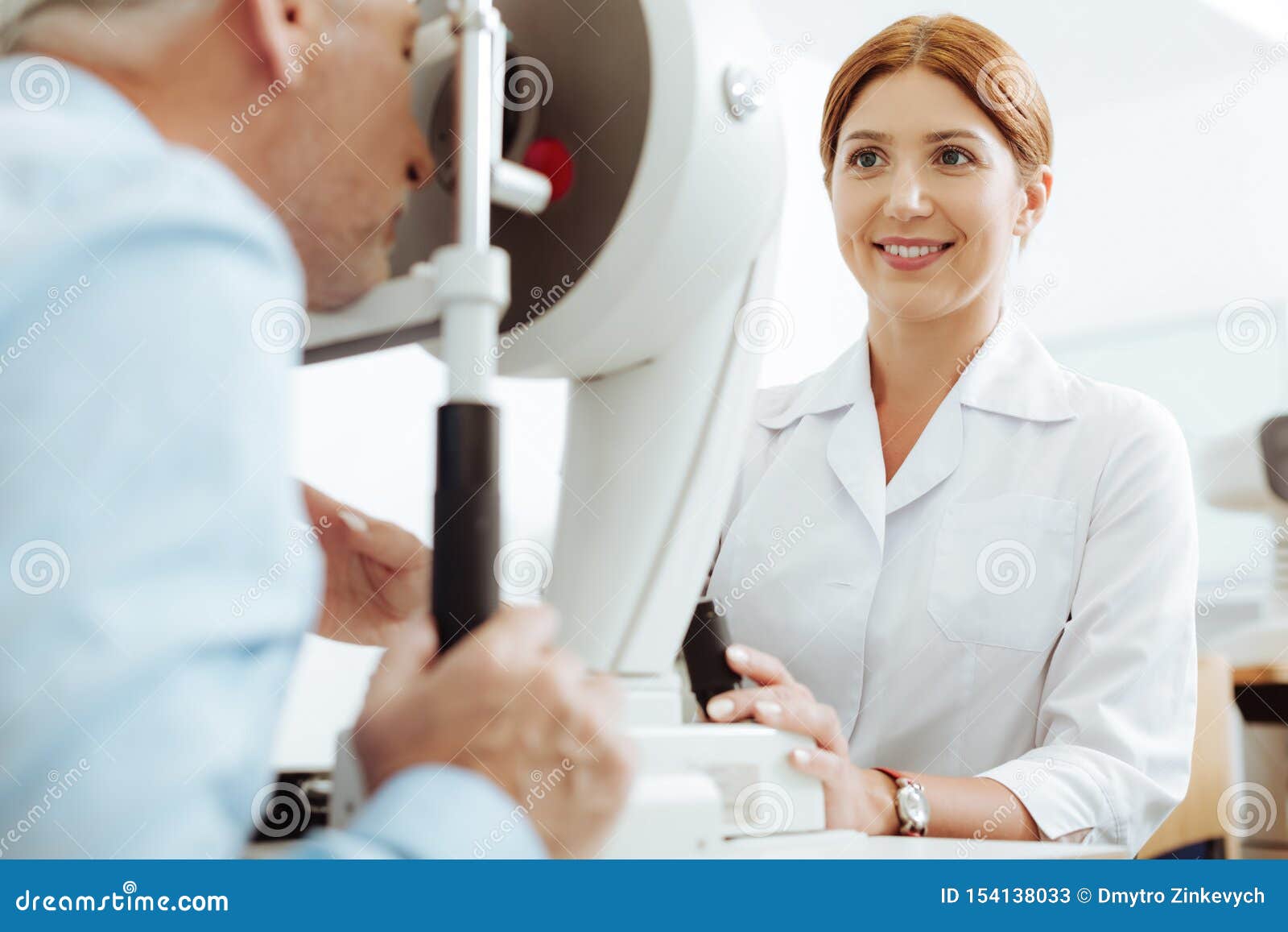 Red-haired Smiling Eye Doctor Enjoying the Process of Work Stock Image ...