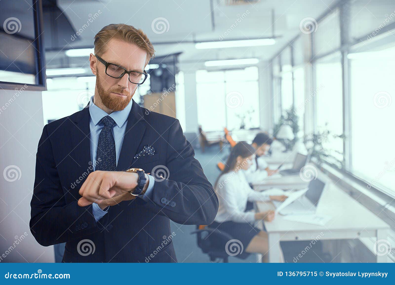 Man looks at his watch stock image. Image of male, modern - 136795715