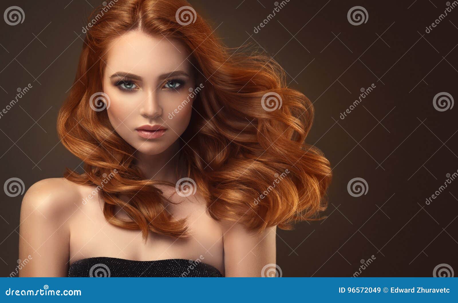 Red Haired Woman With Voluminous Shiny And Curly Hairstyle Flying Hair