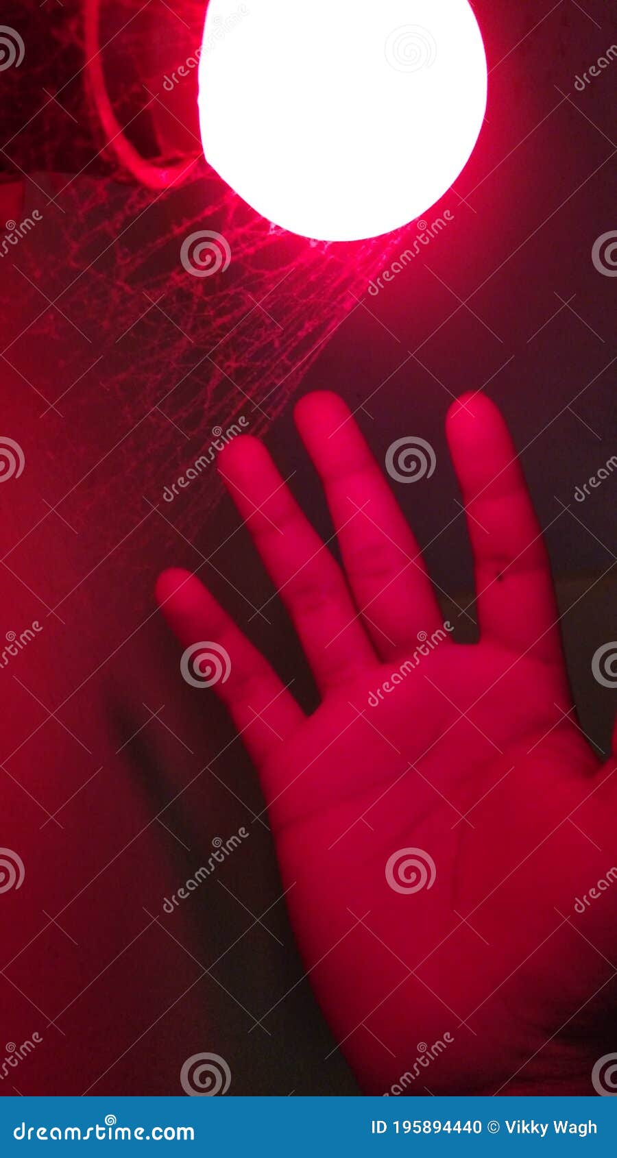 Red hand with red light stock photo. Image of light - 195894440