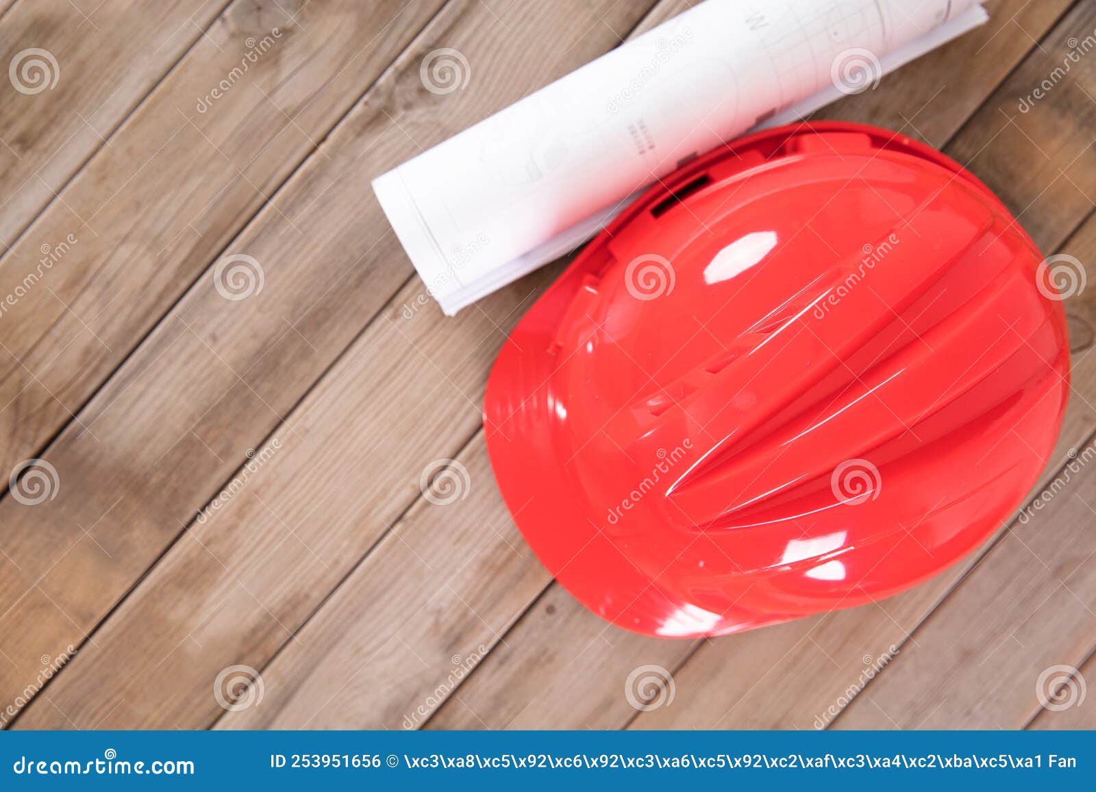 Red Hard Hat and a Roll of Blueprints Stock Photo - Image of ...