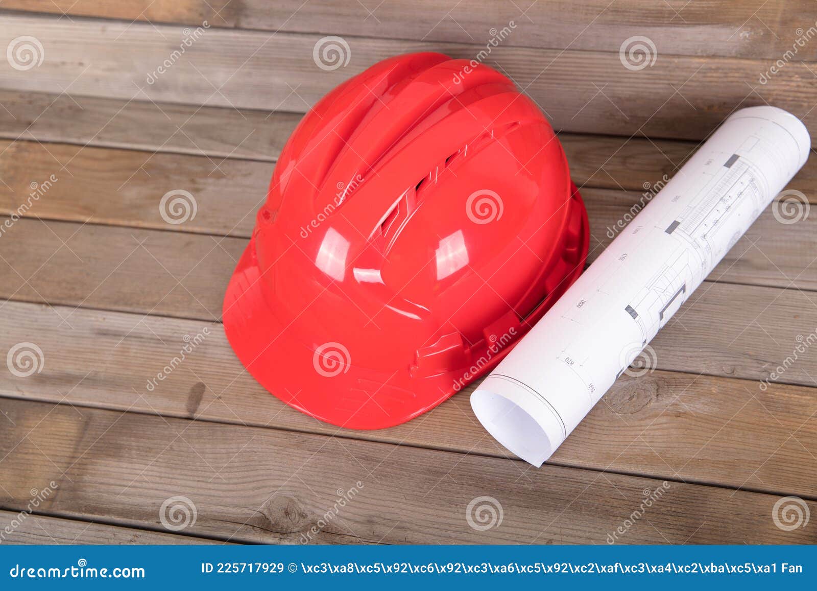 Red Hard Hat and a Roll of Drawings on the Table Stock Image - Image of ...