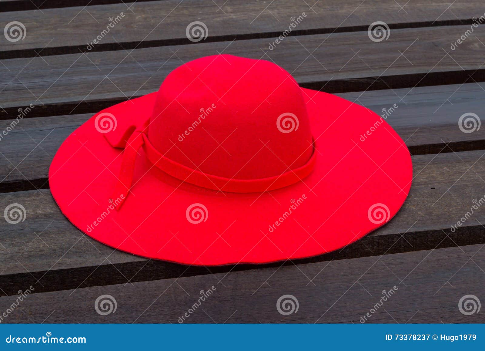 Red hat on wooden floor stock image. Image of texture - 73378237