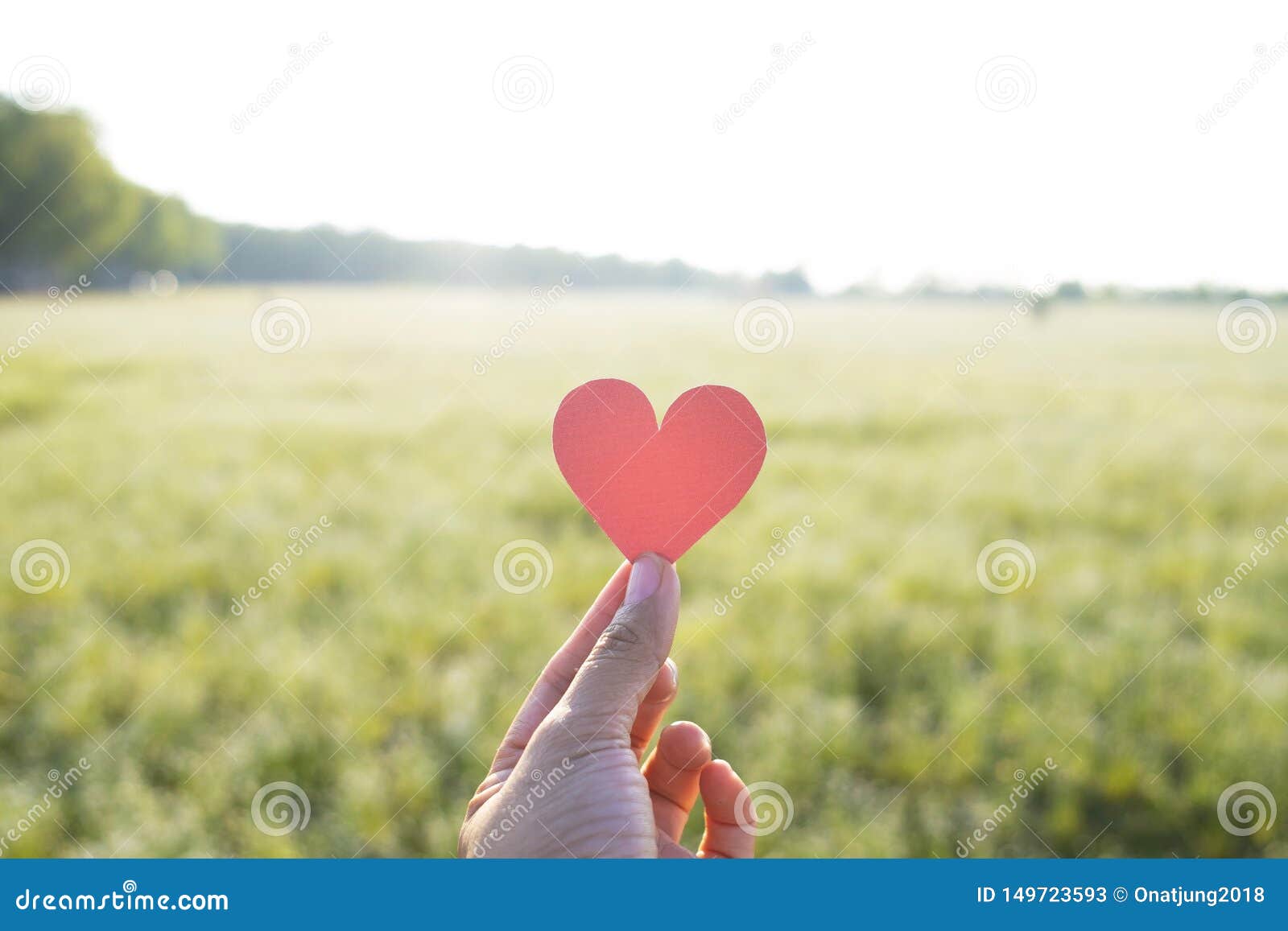 Red heart put on finger. stock image. Image of hand - 149723593