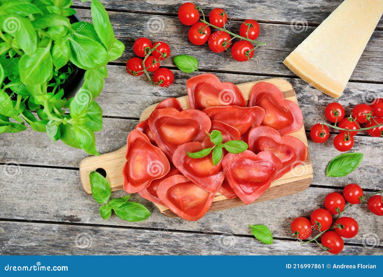 Red Heart Ravioli with Tomato, Mozzarella and Basil on Table Stock ...