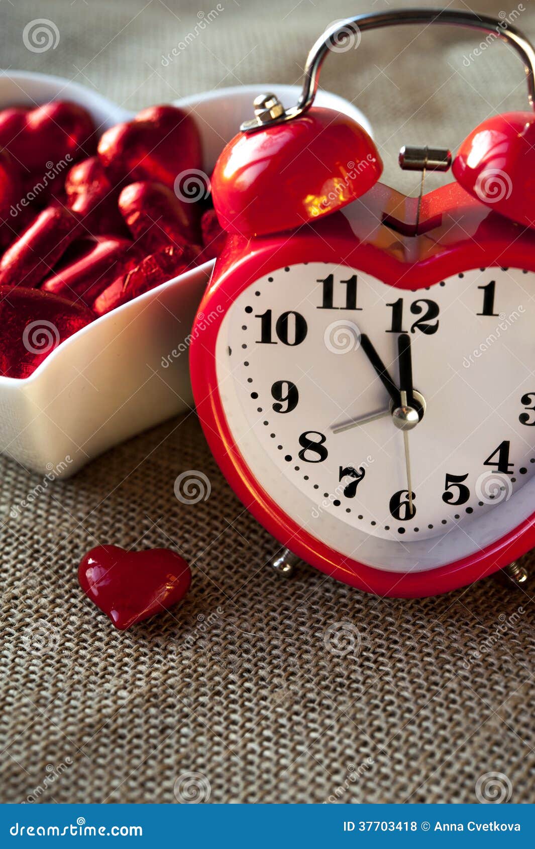 Red Heart Shaped Clock with Sweet Chocolates Stock Photo - Image of ...